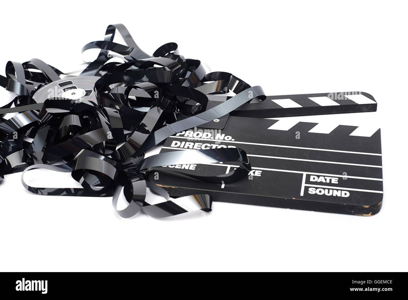Movie clapper board with video tape on white background Stock Photo - Alamy