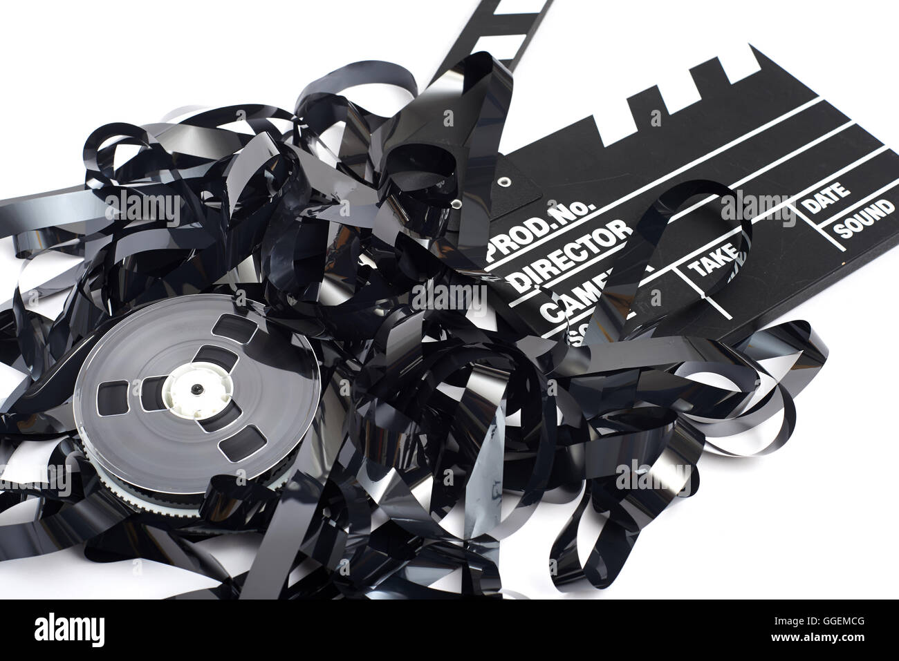 Movie clapper board with video tape on white background Stock Photo - Alamy