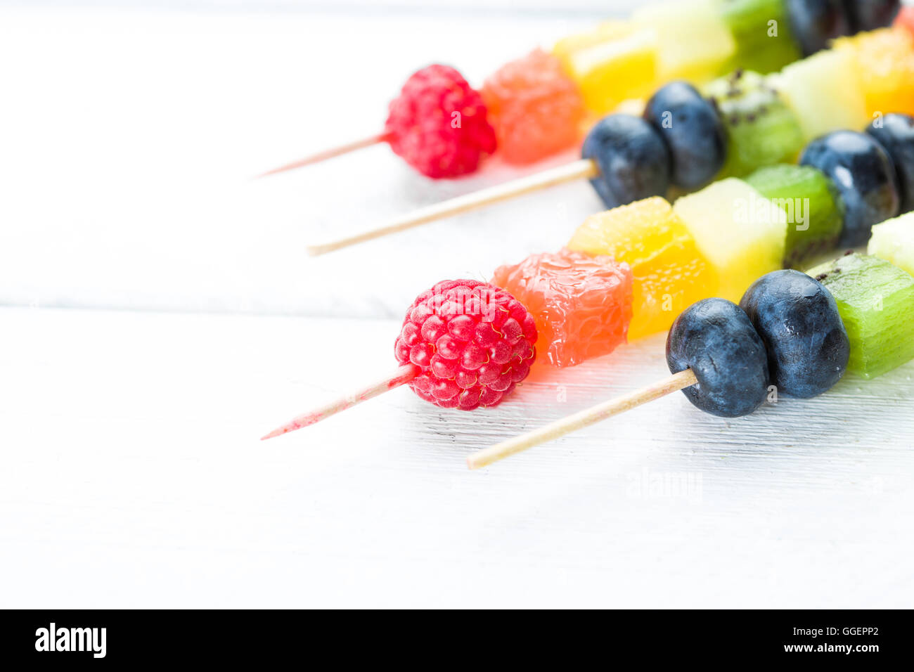 Fresh summer fruits on sticks Stock Photo - Alamy