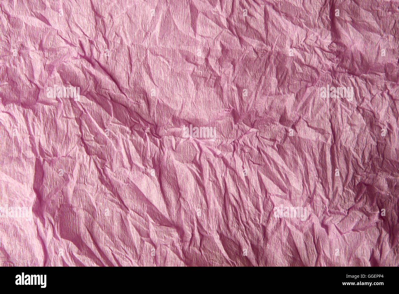 pink color crumpled paper as a background Stock Photo - Alamy