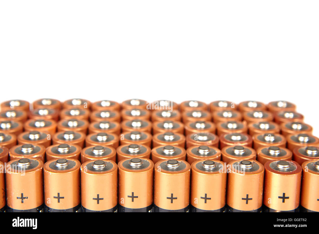 gold batteries in rows with silver tops close up Stock Photo - Alamy