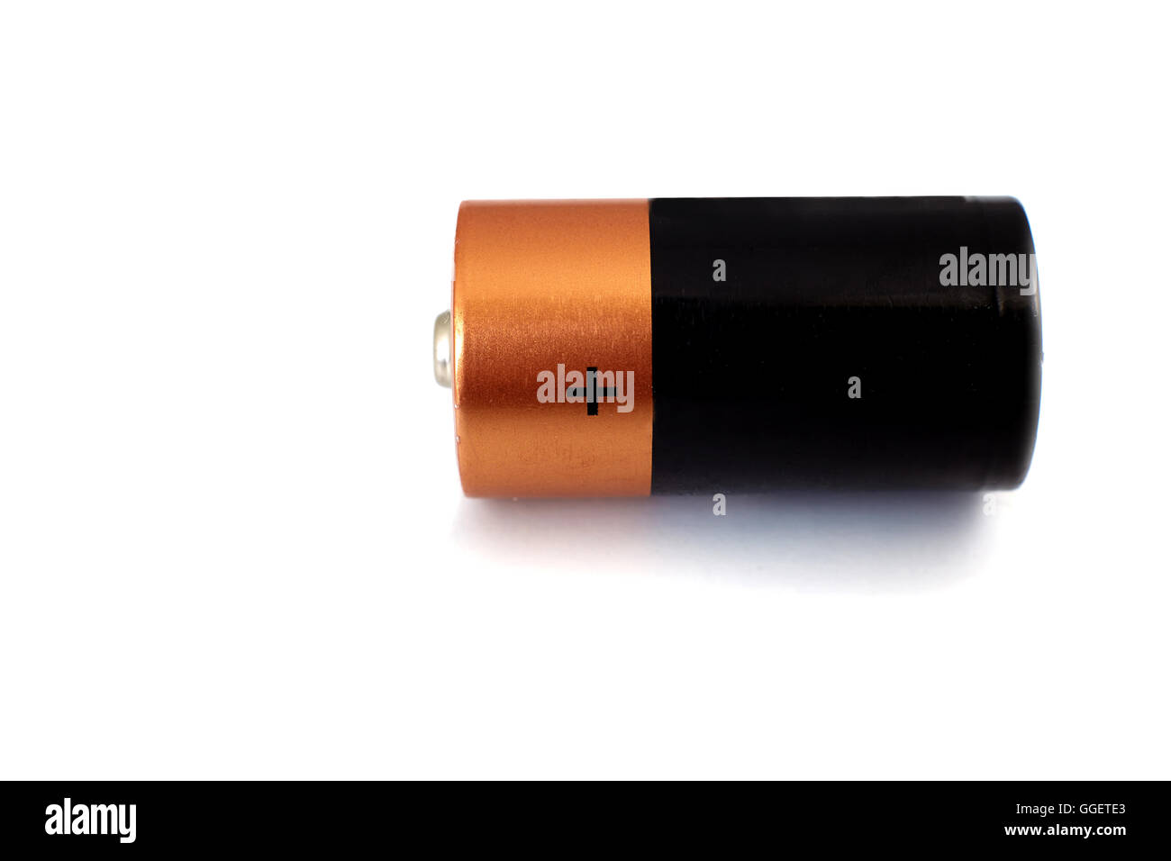 gold batteries in rows with silver tops close up Stock Photo - Alamy