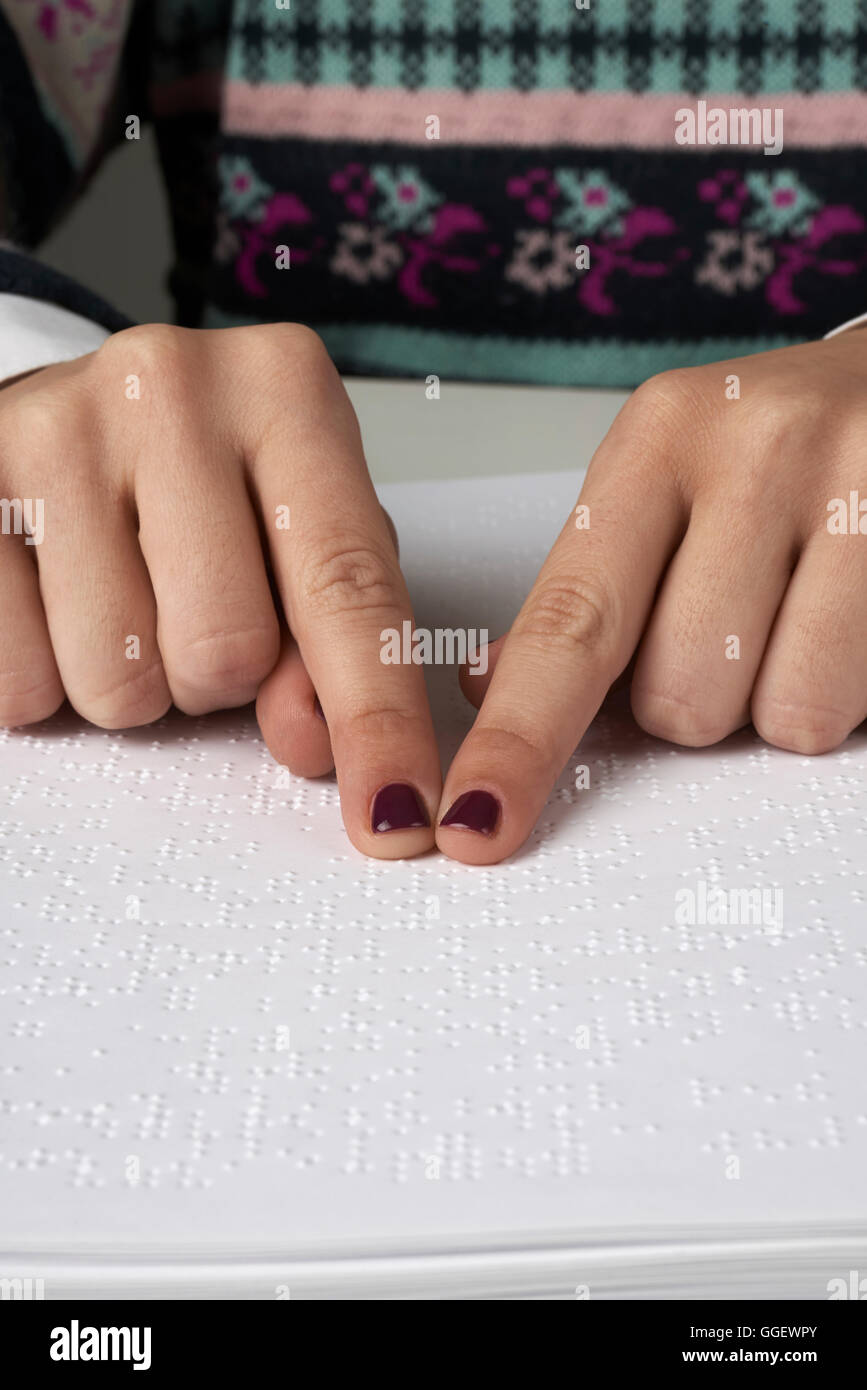 Blind woman reading text in braille language Stock Photo - Alamy