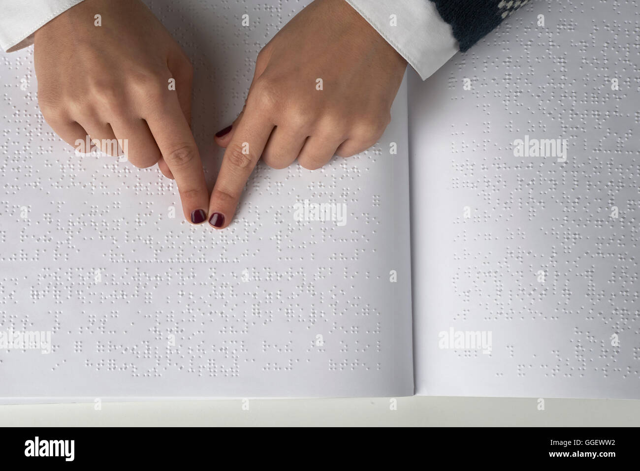 Blind woman reading text in braille language Stock Photo - Alamy