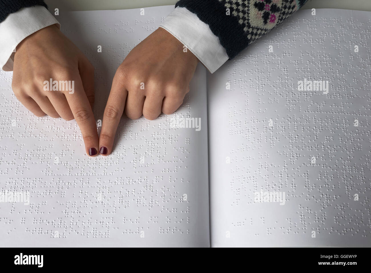 Blind woman reading text in braille language Stock Photo - Alamy