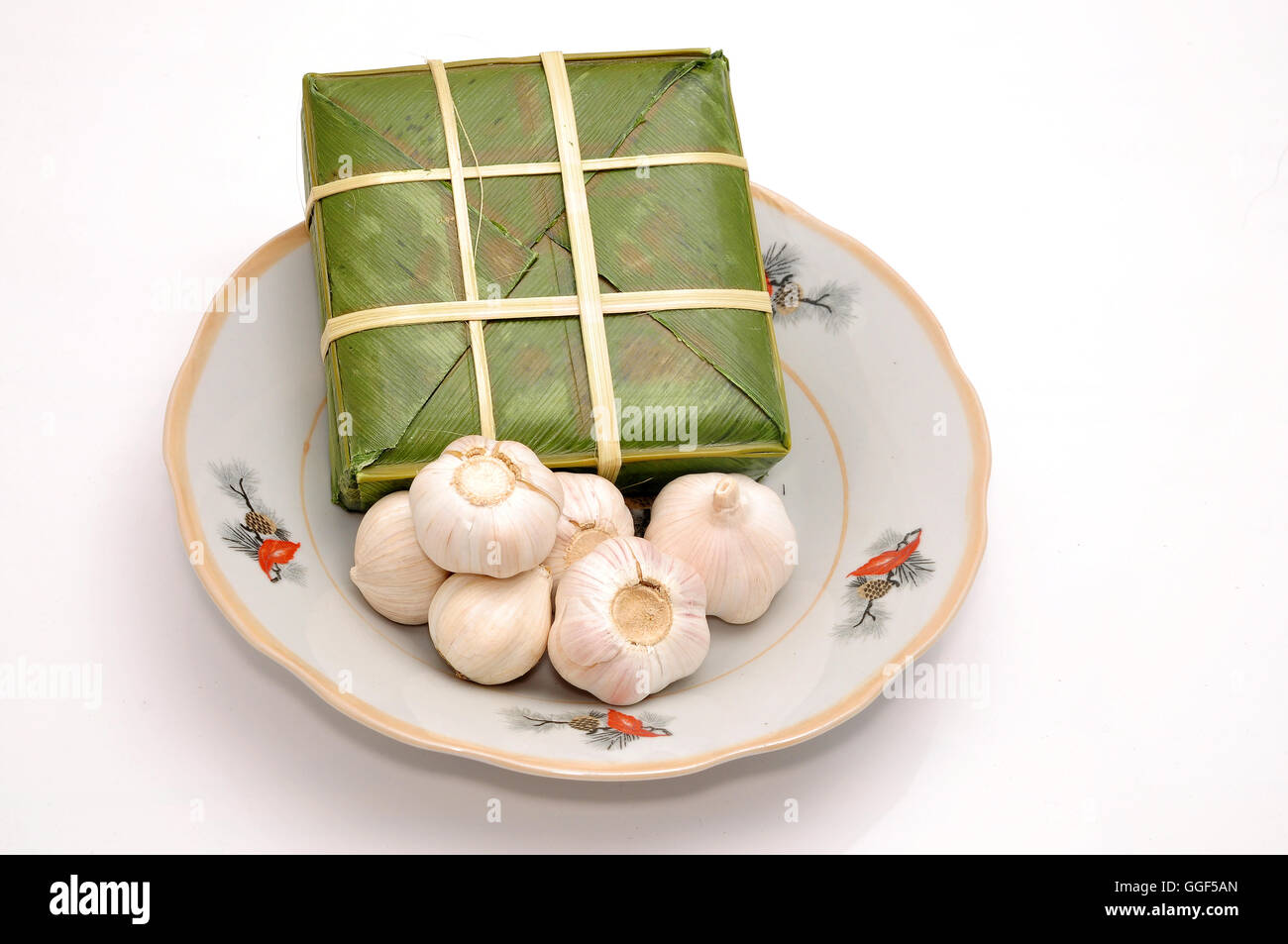 stuffed sticky rice cake or Banh Chung on a white background Stock ...