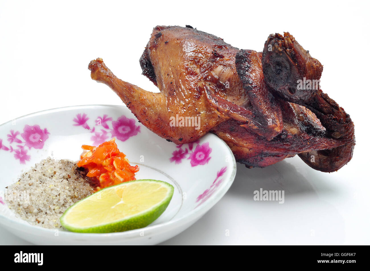 Vietnamese grilled quail on a white background Stock Photo - Alamy