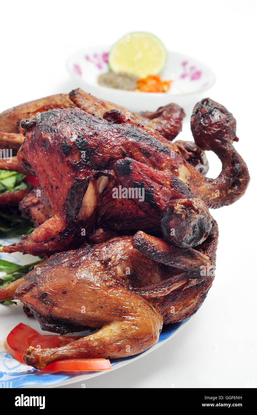 Vietnamese grilled quail on a white background Stock Photo - Alamy