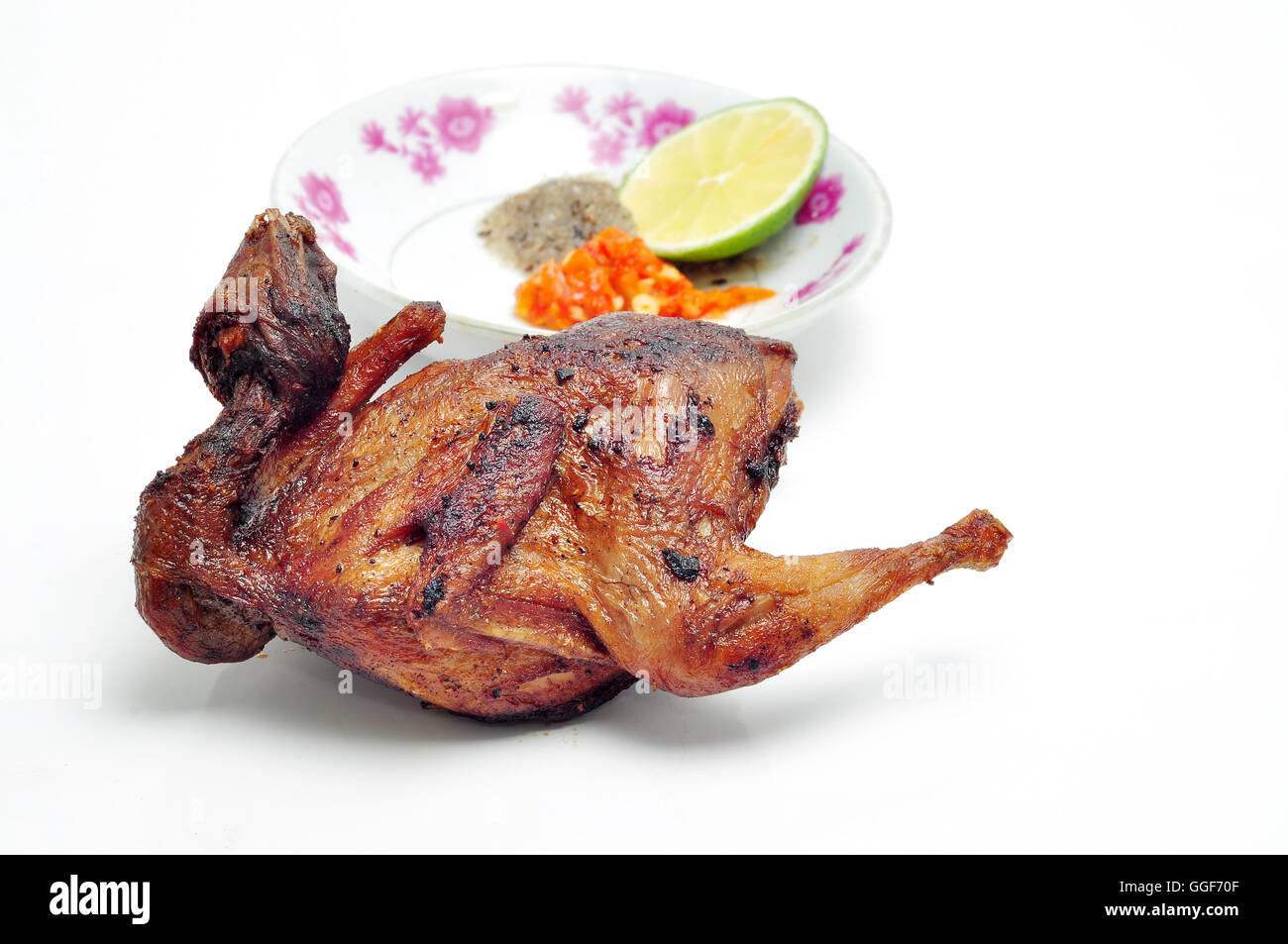 Vietnamese grilled quail on a white background Stock Photo - Alamy
