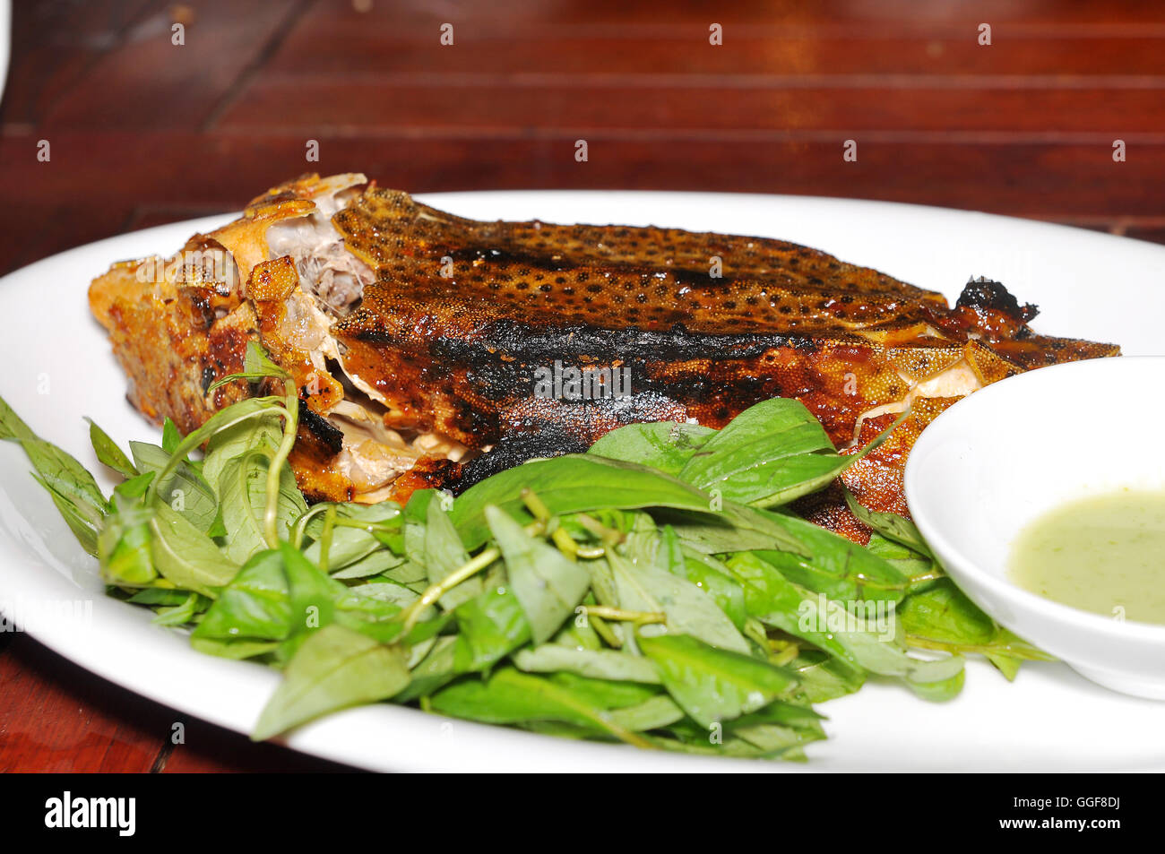 Grilled boxfish on the dish in the restaurant Stock Photo - Alamy