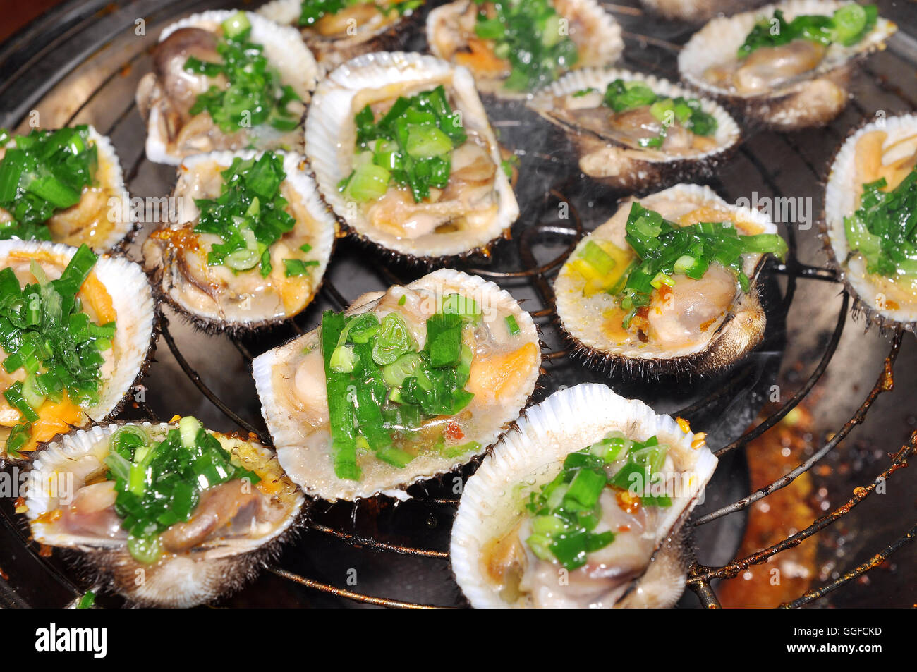 Clams hot on grill hi-res stock photography and images - Alamy