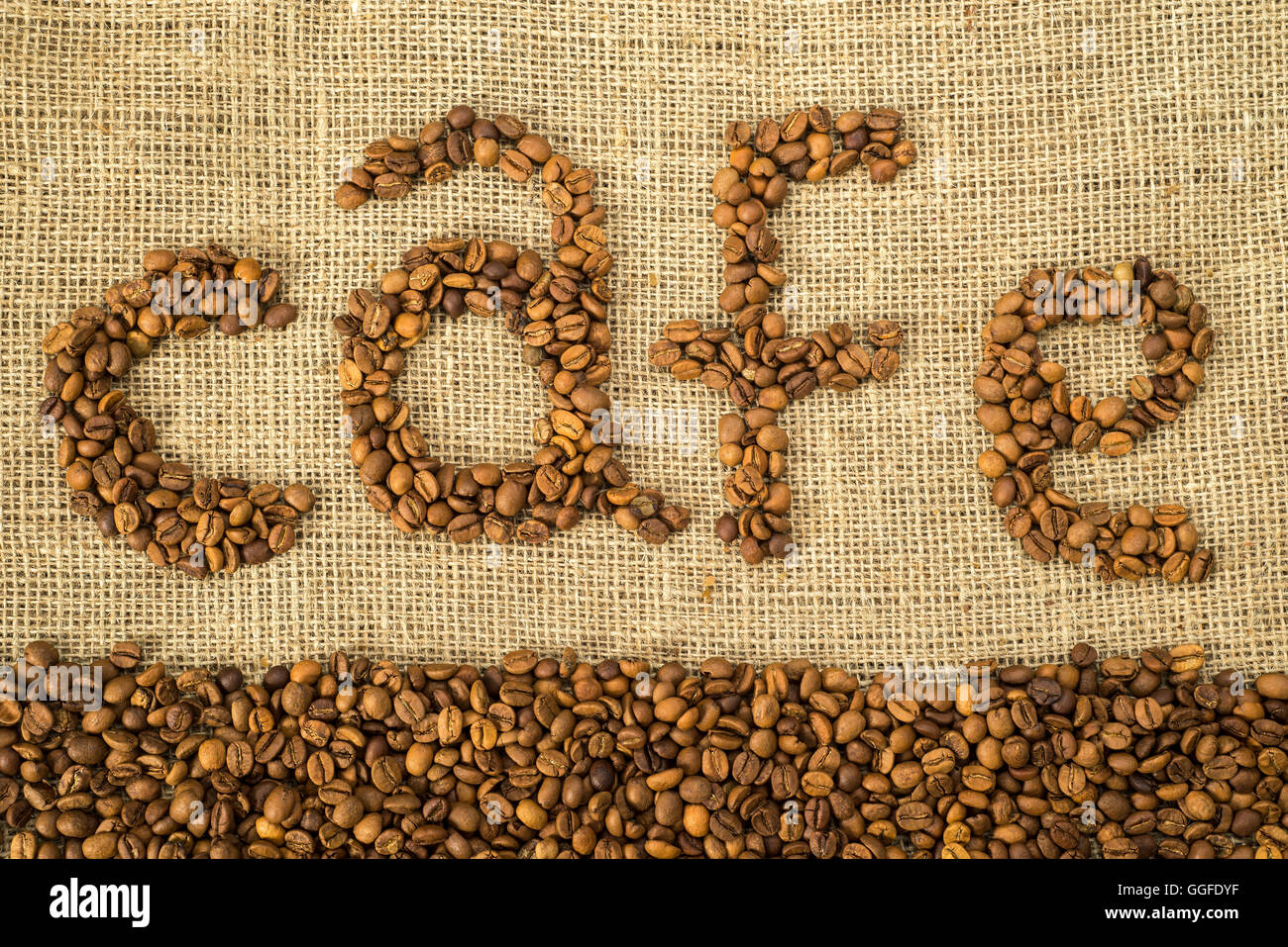 Word cafe made with coffee beans on burlap Stock Photo - Alamy