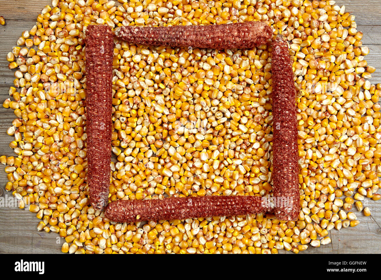 frame made of corn seeds with wooden background Stock Photo - Alamy