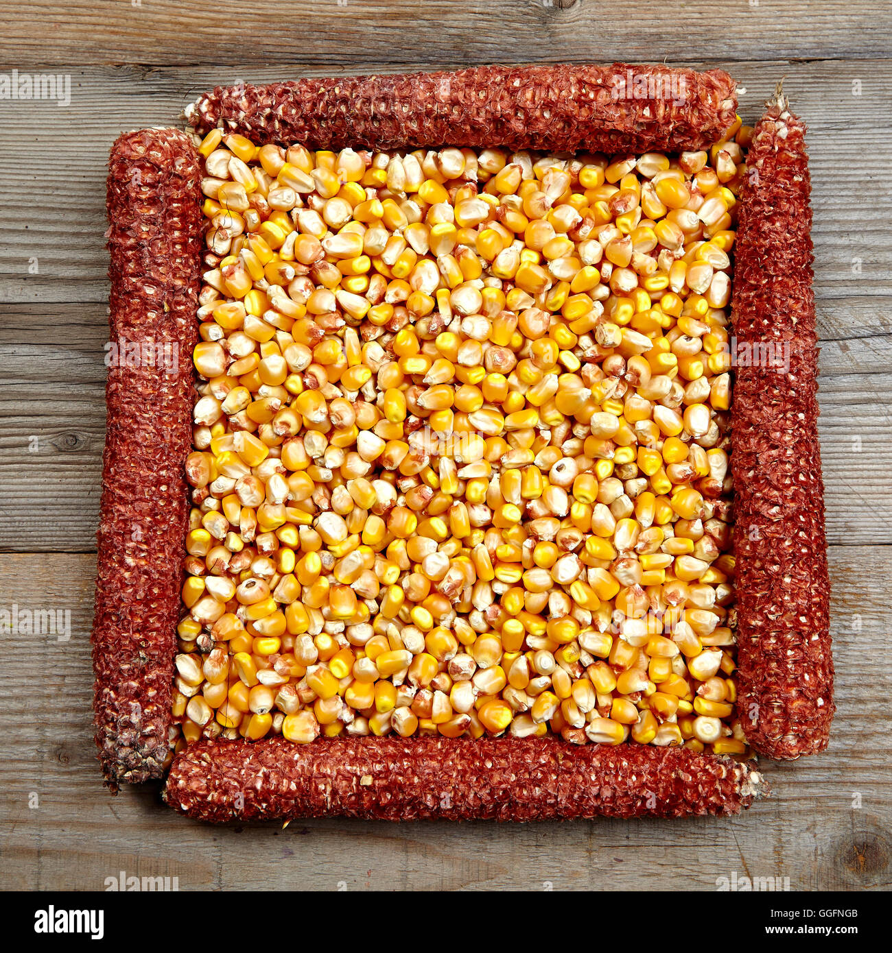 frame made of corn seeds with wooden background Stock Photo - Alamy