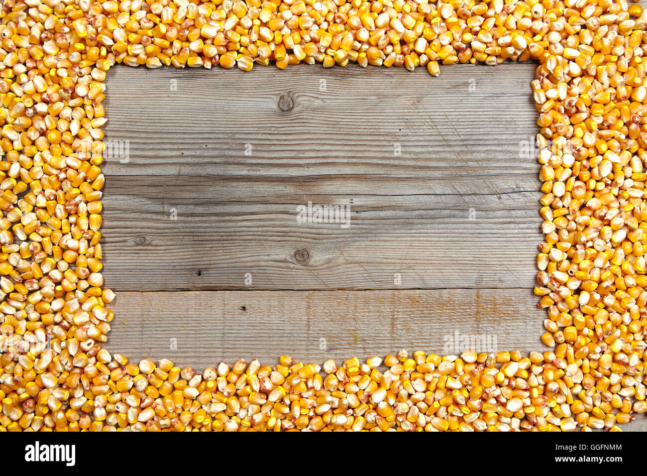 frame made of corn seeds with wooden background Stock Photo - Alamy