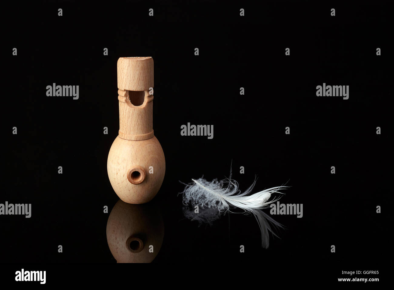 wooden whistles for calling ducks with a feather Stock Photo - Alamy