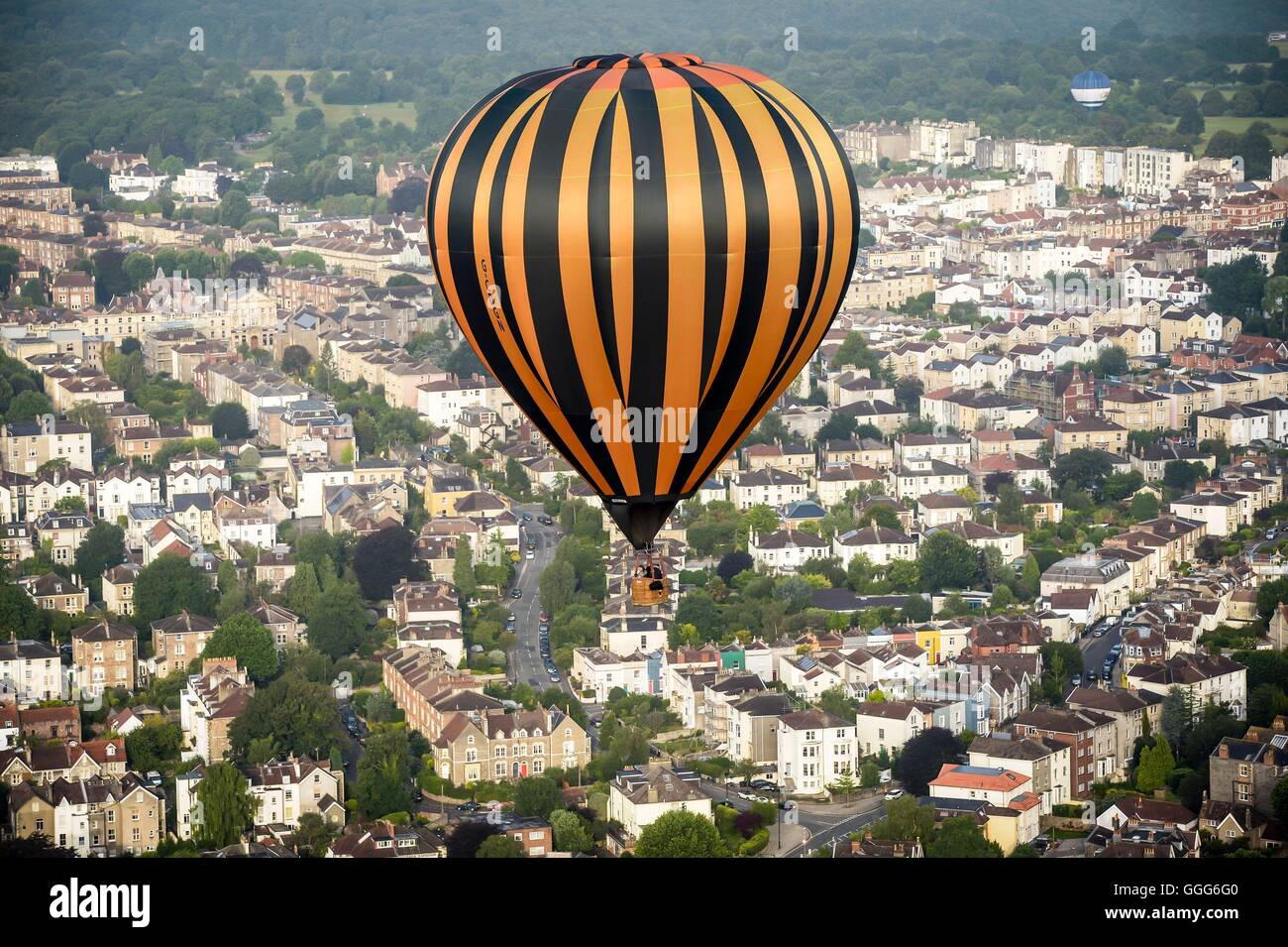 A hot air balloon passes over the city of Bristol during a mass balloon ...