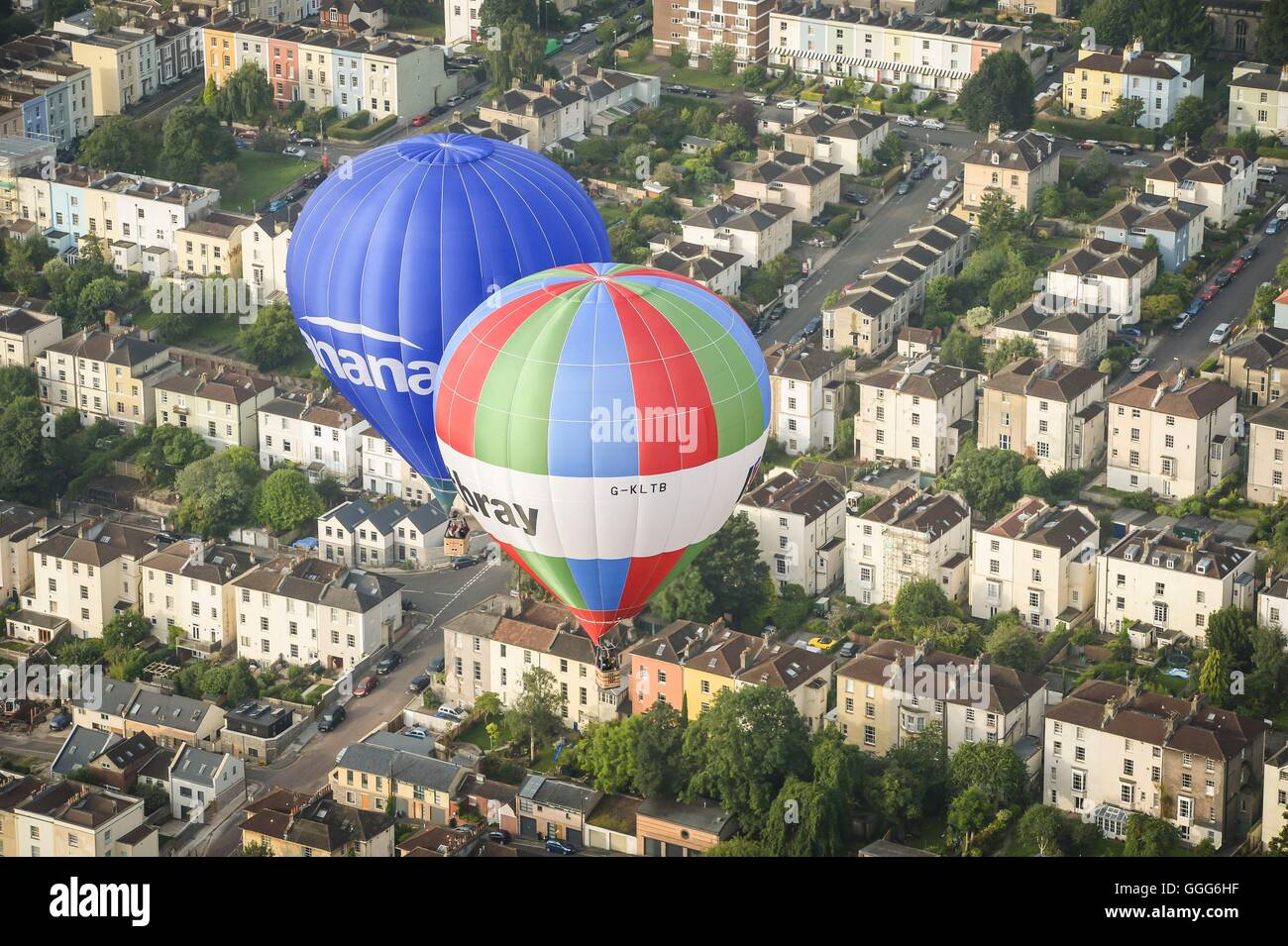 Hot air balloons pass over the city of Bristol during a mass balloon ...
