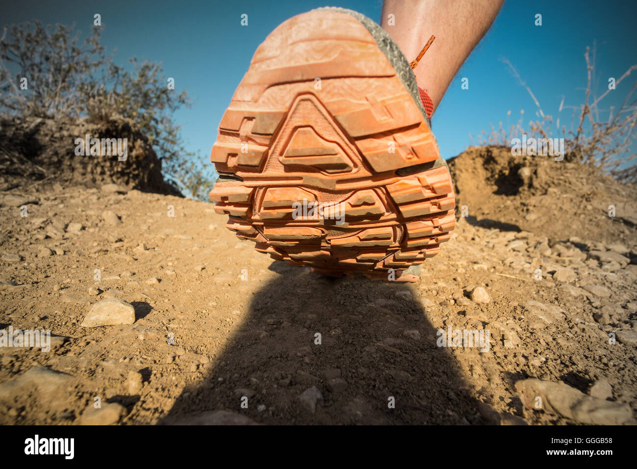 Low angle viewpoint take of the soles of a cross country runner Stock ...
