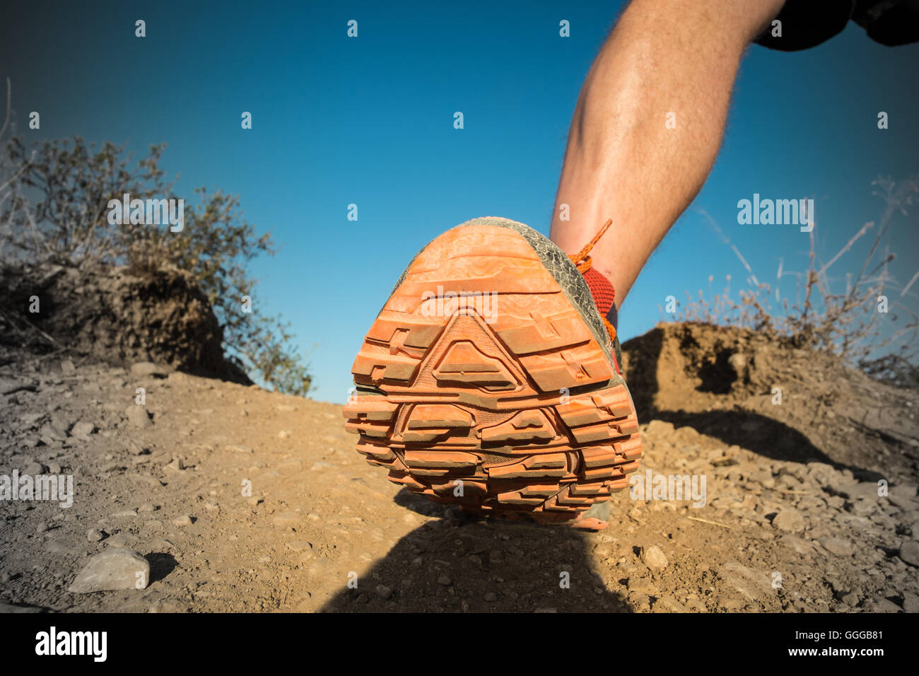 Low angle viewpoint take of the soles of a cross country runner Stock ...