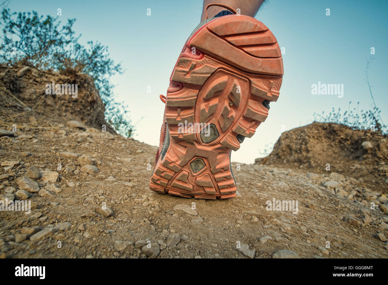 Low angle viewpoint take of the soles of a cross country runner Stock ...