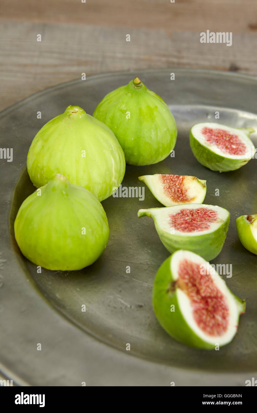 green fresh figs in a metallic plate Stock Photo - Alamy