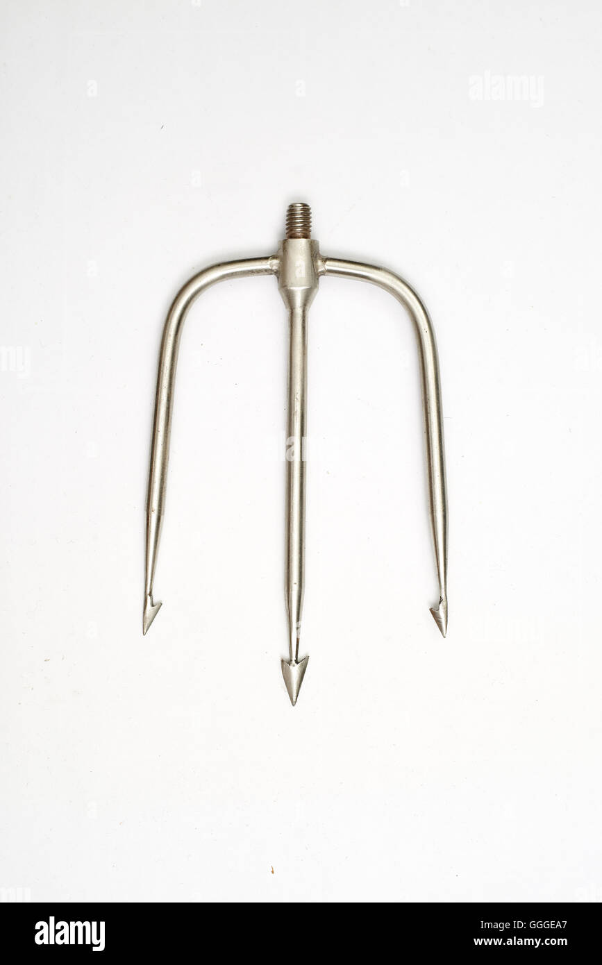 metal fishing trident isolate on a white background Stock Photo - Alamy