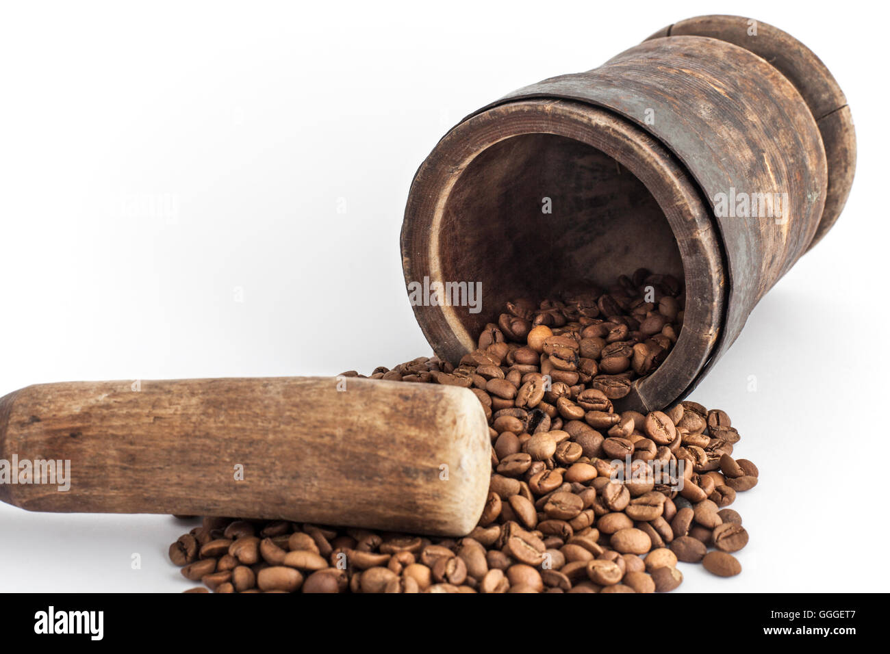Mortar and pestle with coffee seeds closeup in studio on white ...