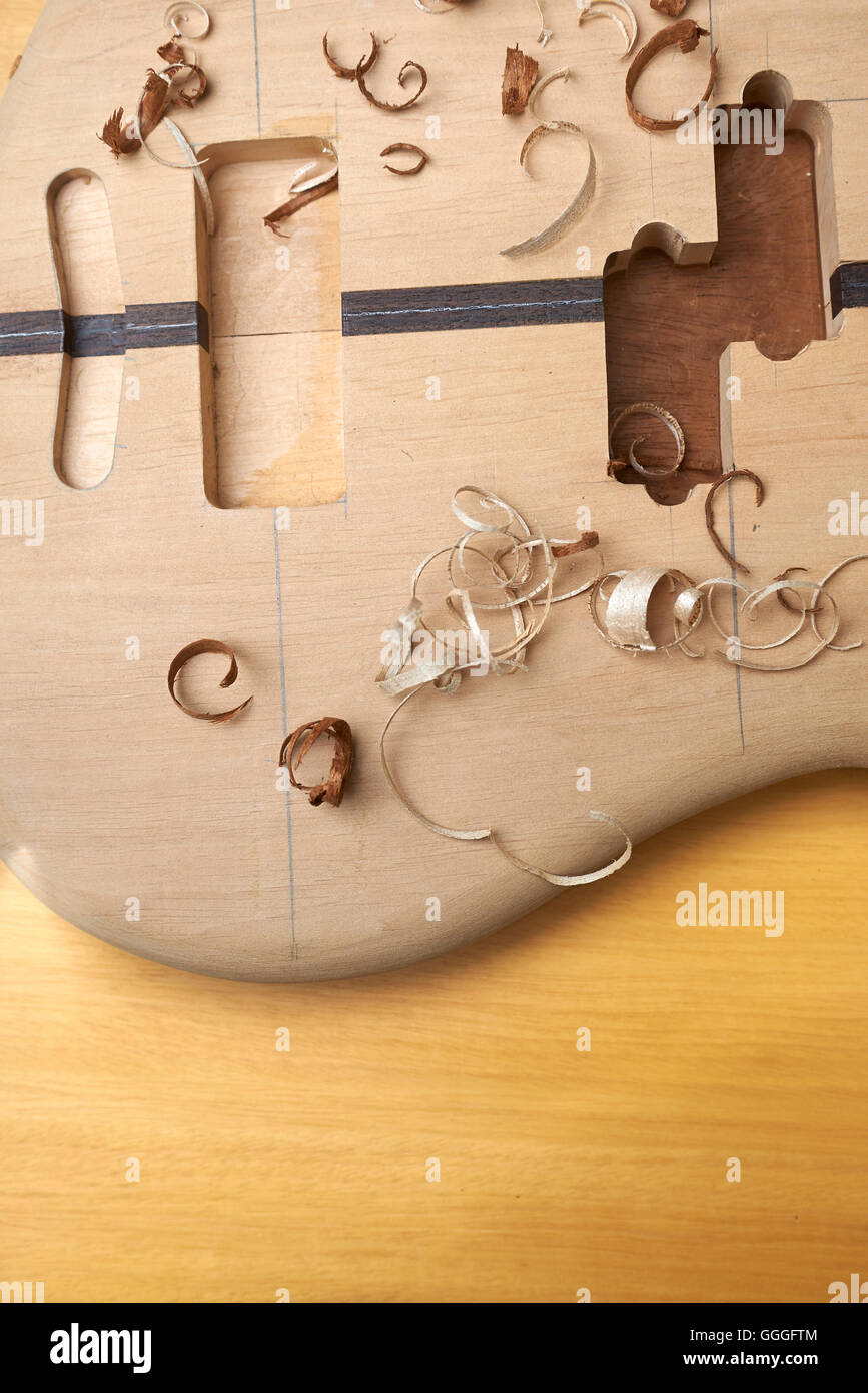 Bass guitar under construction, with tools and accessories Stock Photo ...