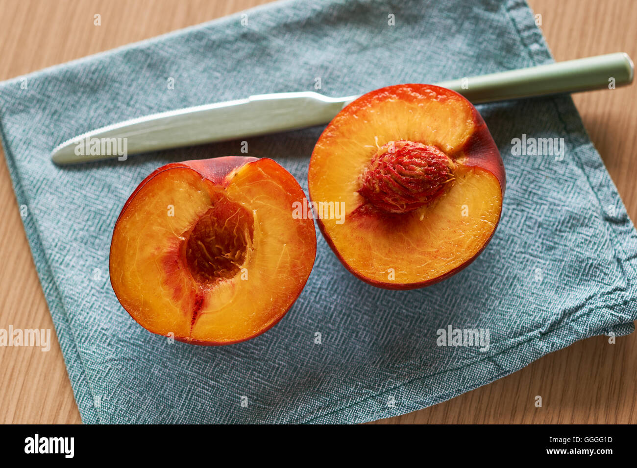 Peach cut in half hi-res stock photography and images - Alamy