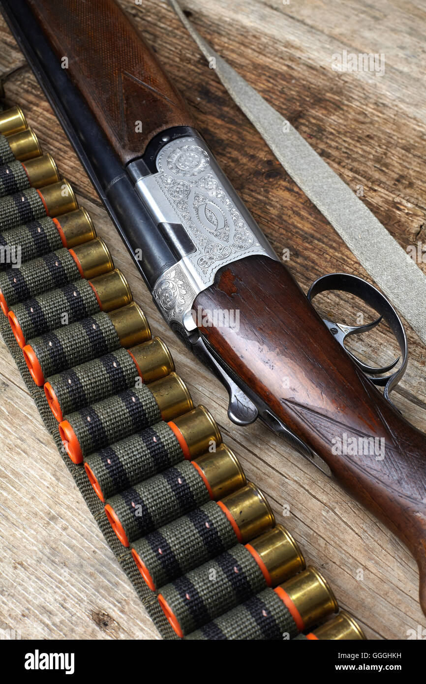 vintage hunting gun with cartridges on wooden background Stock Photo ...