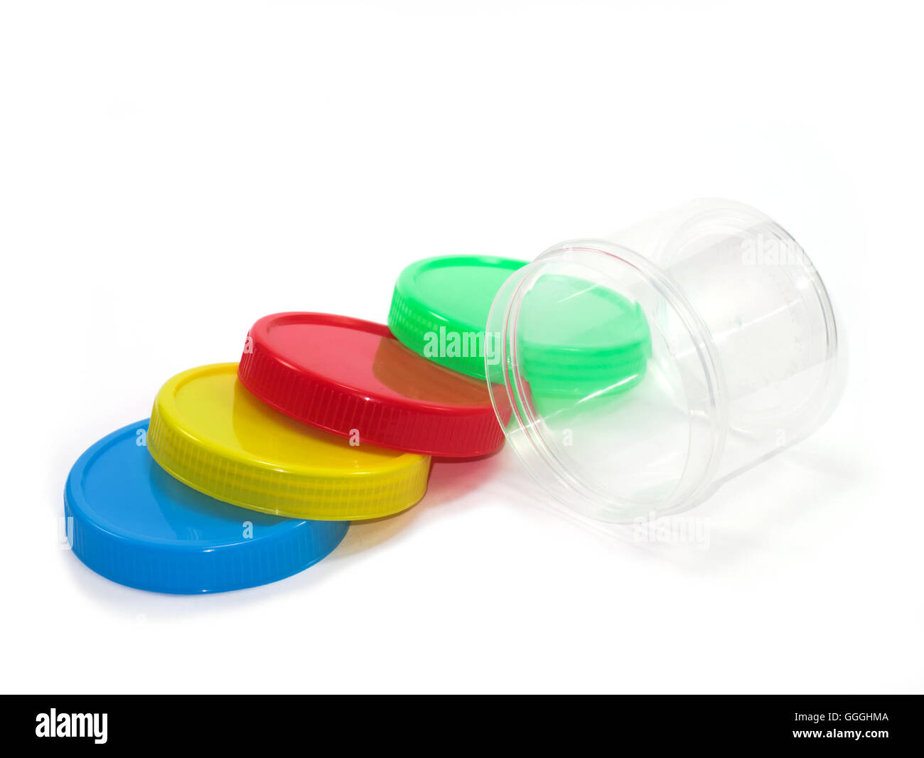 plastic transparent cylinder container with four coloured lids Stock ...