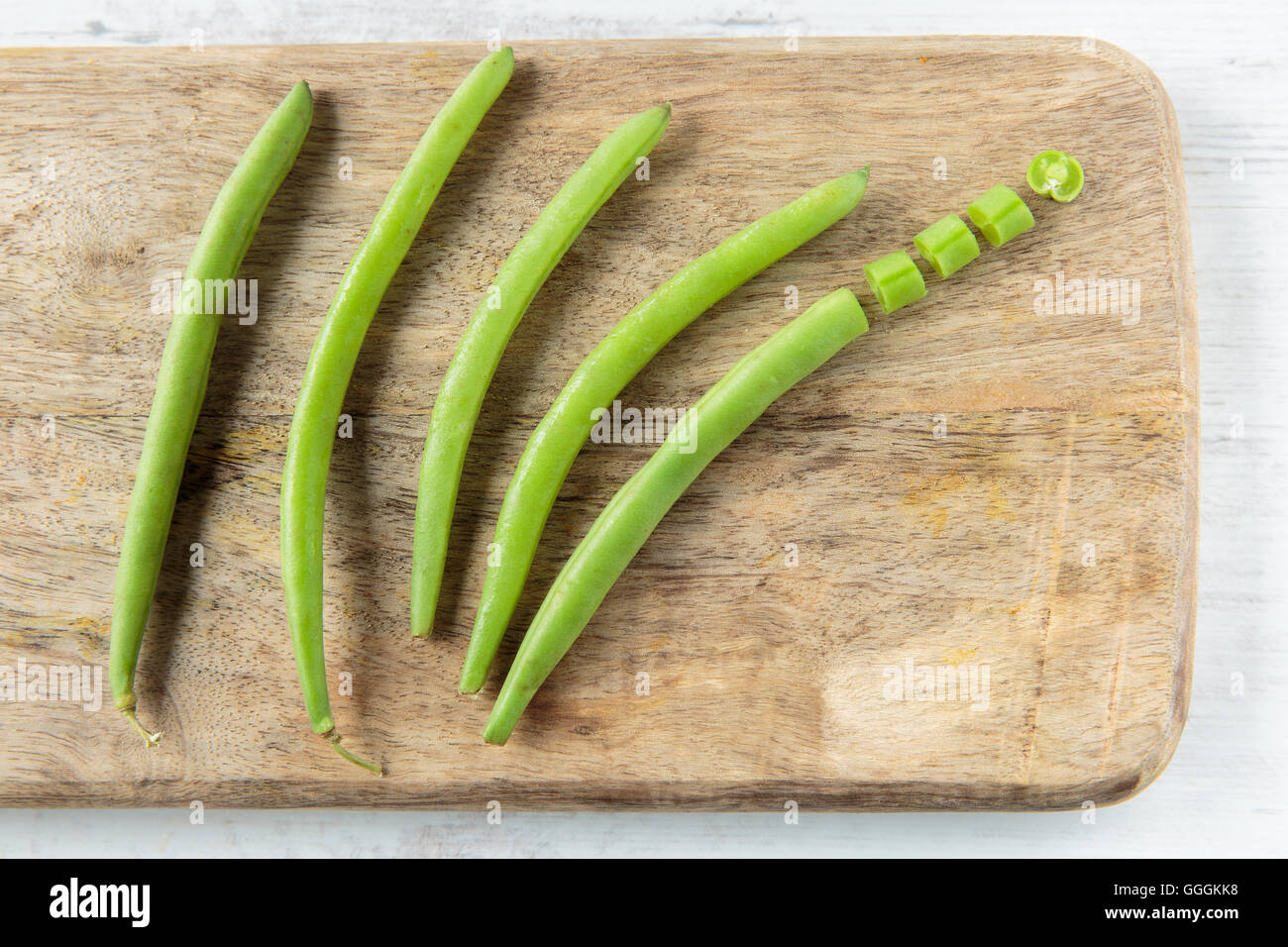 Fresh raw green beans on a chopping board Stock Photo - Alamy