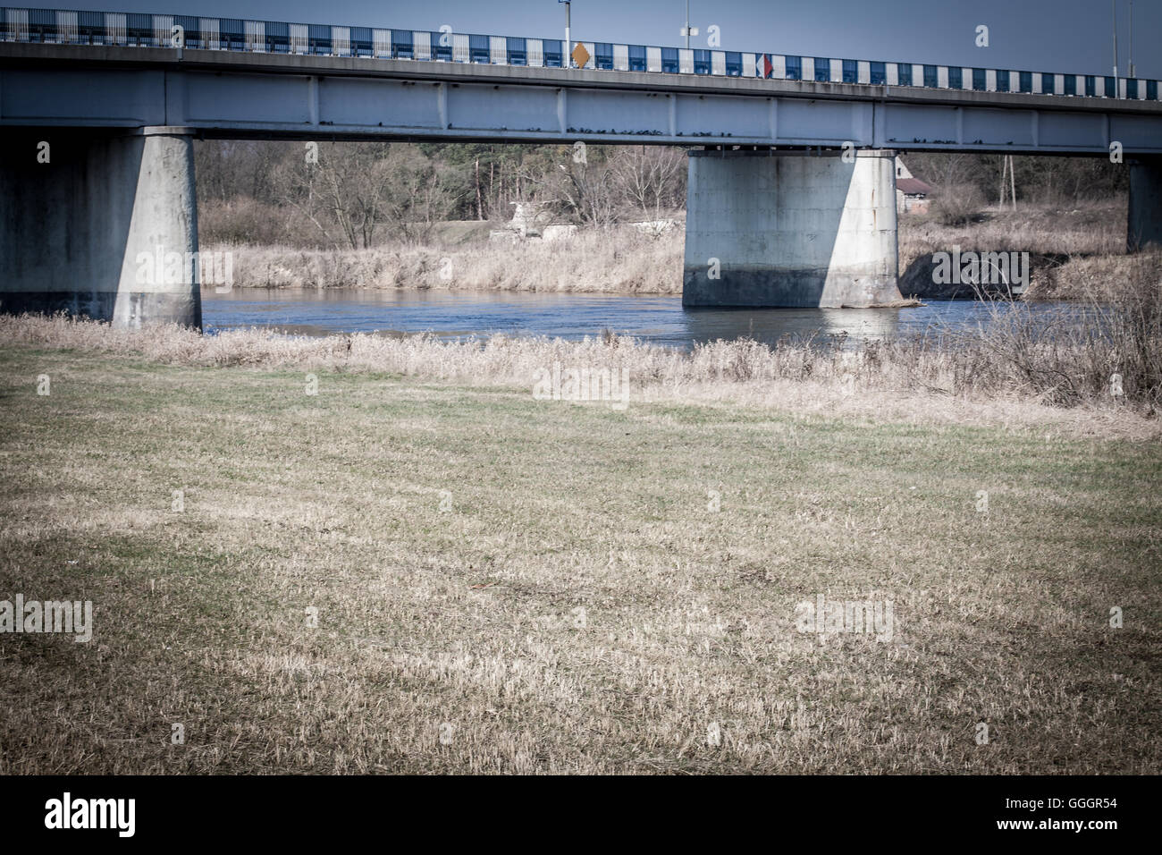 Old road bridge over the river and its grassy flood terrace Stock Photo ...
