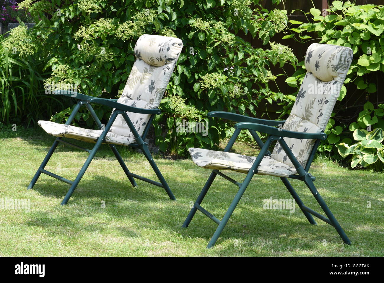 Garden chairs in the garden Stock Photo - Alamy