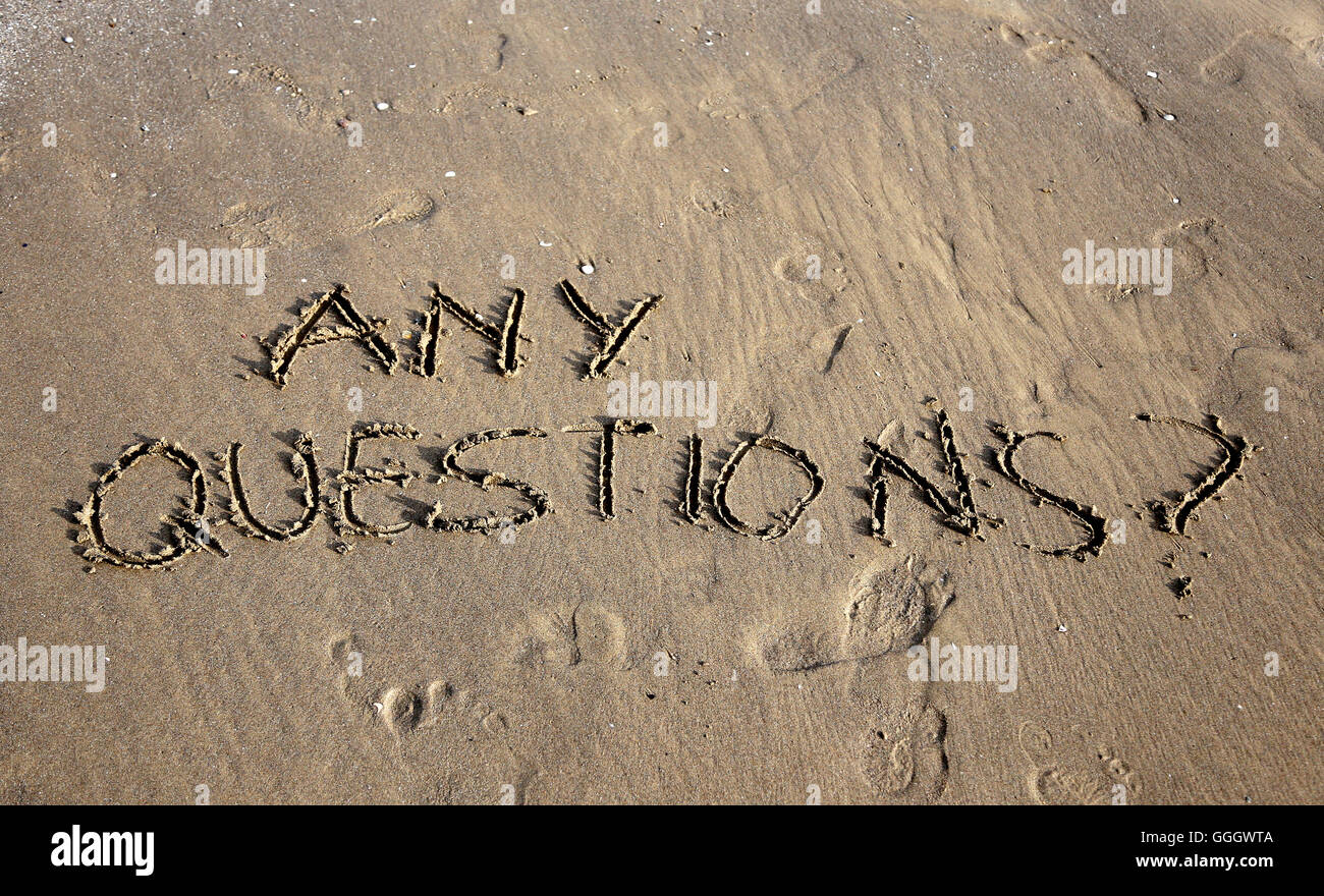 Any Questions writing on the beach sand Stock Photo - Alamy