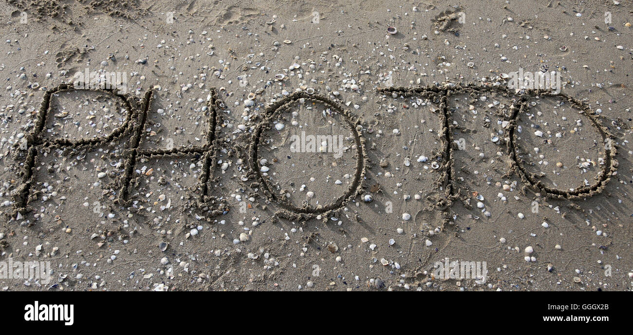 big PHOTO written on the beach sand Stock Photo - Alamy