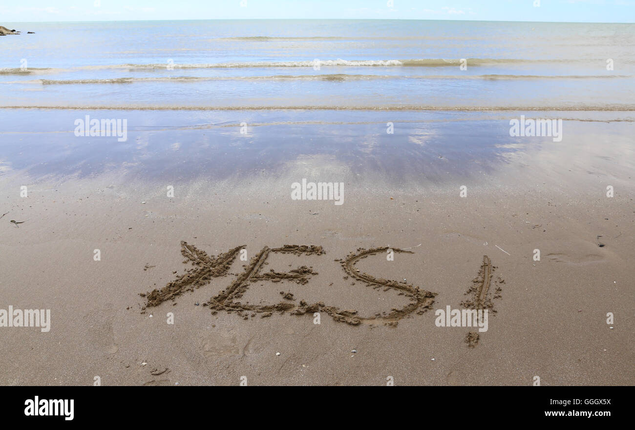 big YES written on the sand Stock Photo - Alamy