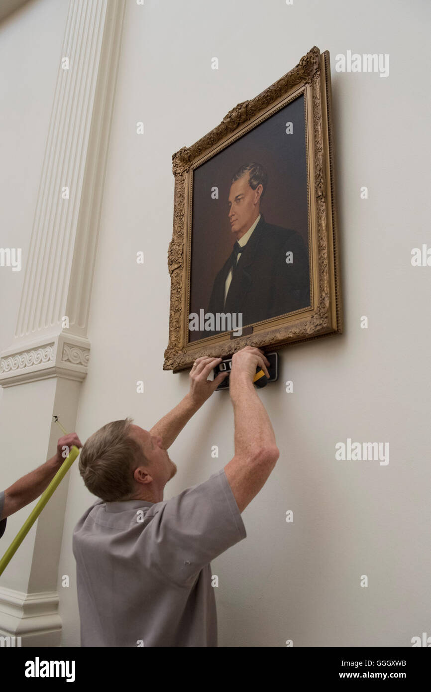 Workers moving all 51 portraits of former Texas governors to make room ...