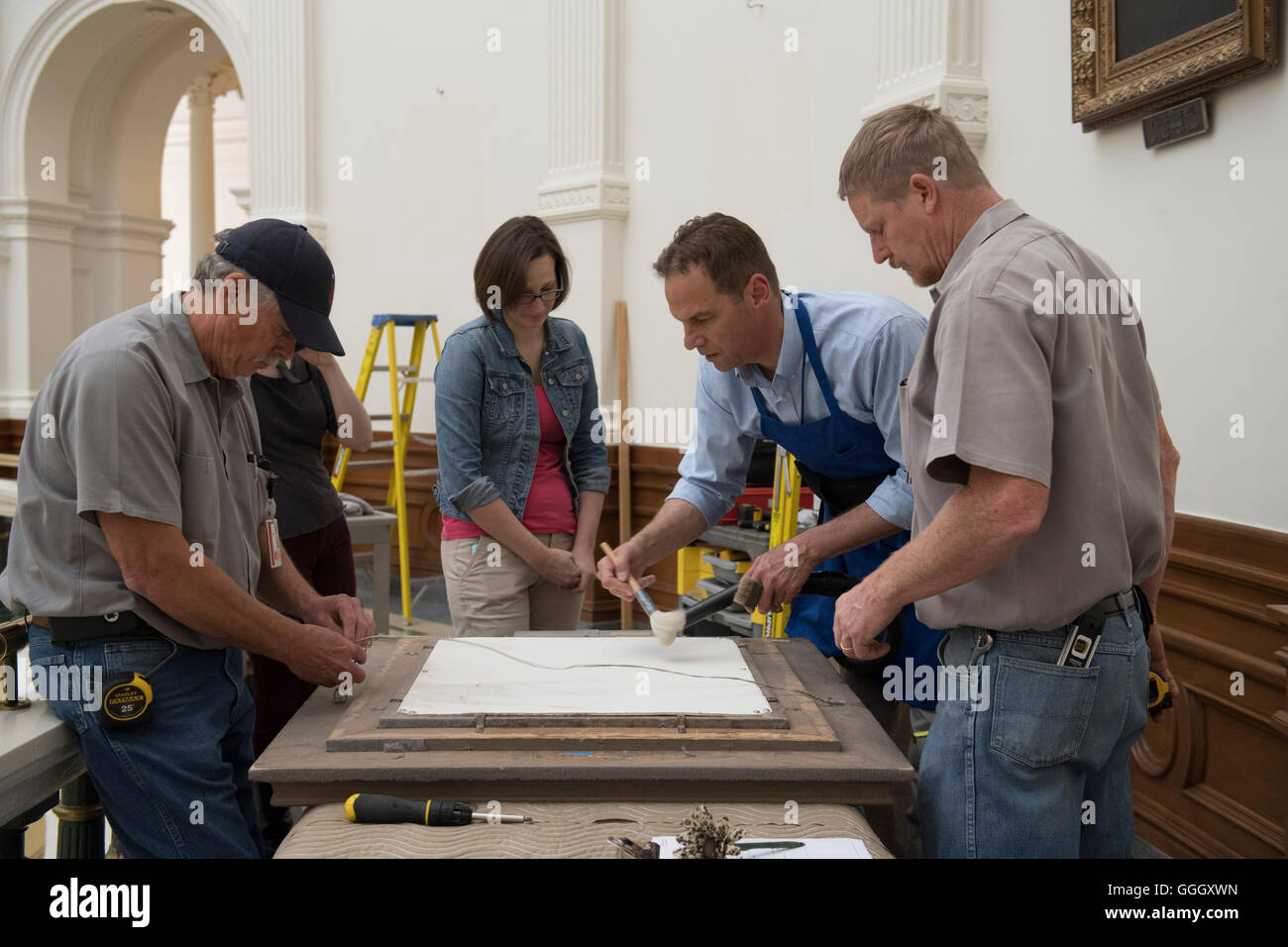 Workers moving all 51 portraits of former Texas governors to make room ...