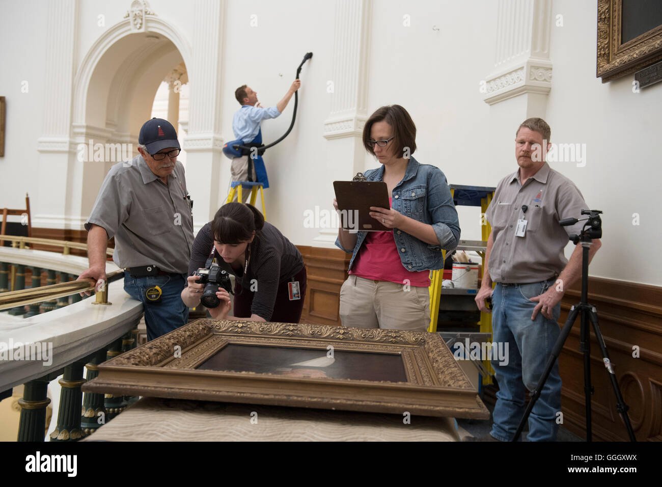 Workers moving all 51 portraits of former Texas governors to make room ...