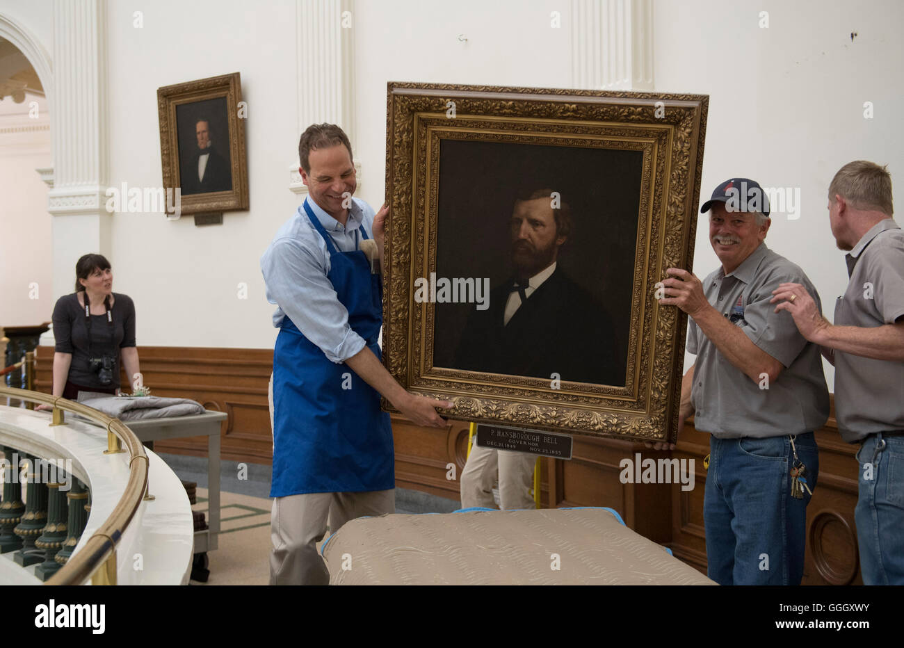 Workers moving all 51 portraits of former Texas governors to make room ...
