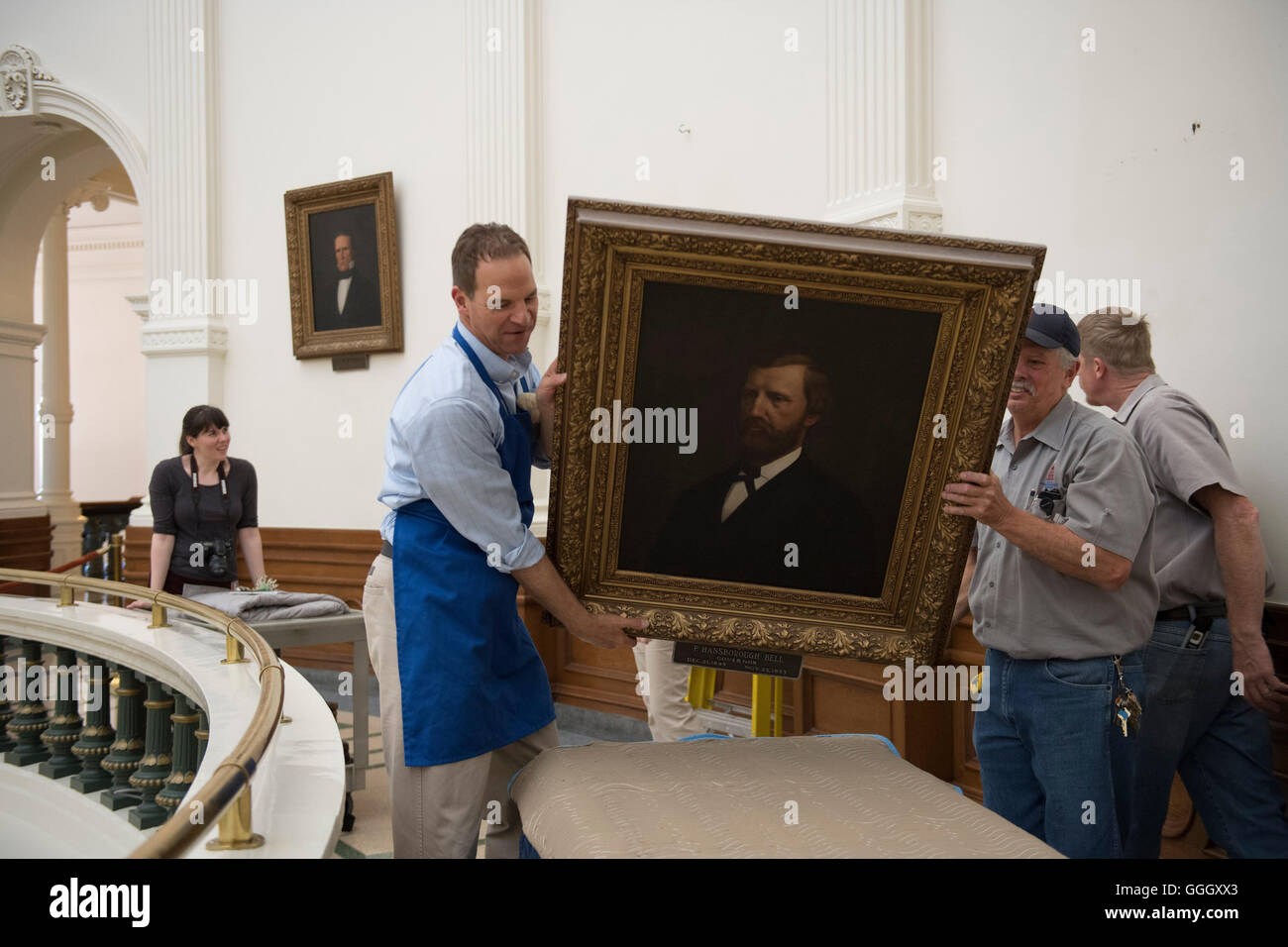 Workers moving all 51 portraits of former Texas governors to make room ...