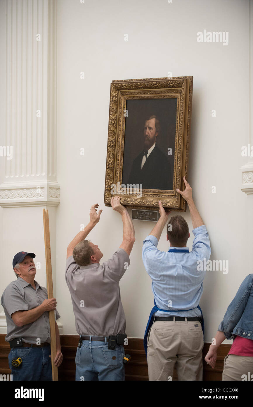 Workers moving all 51 portraits of former Texas governors to make room ...