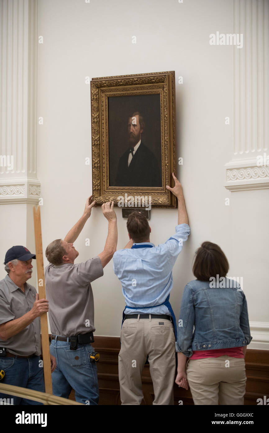 Workers moving all 51 portraits of former Texas governors to make room ...