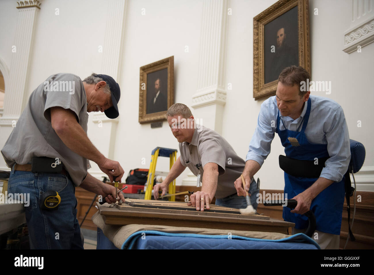 Workers moving all 51 portraits of former Texas governors to make room ...