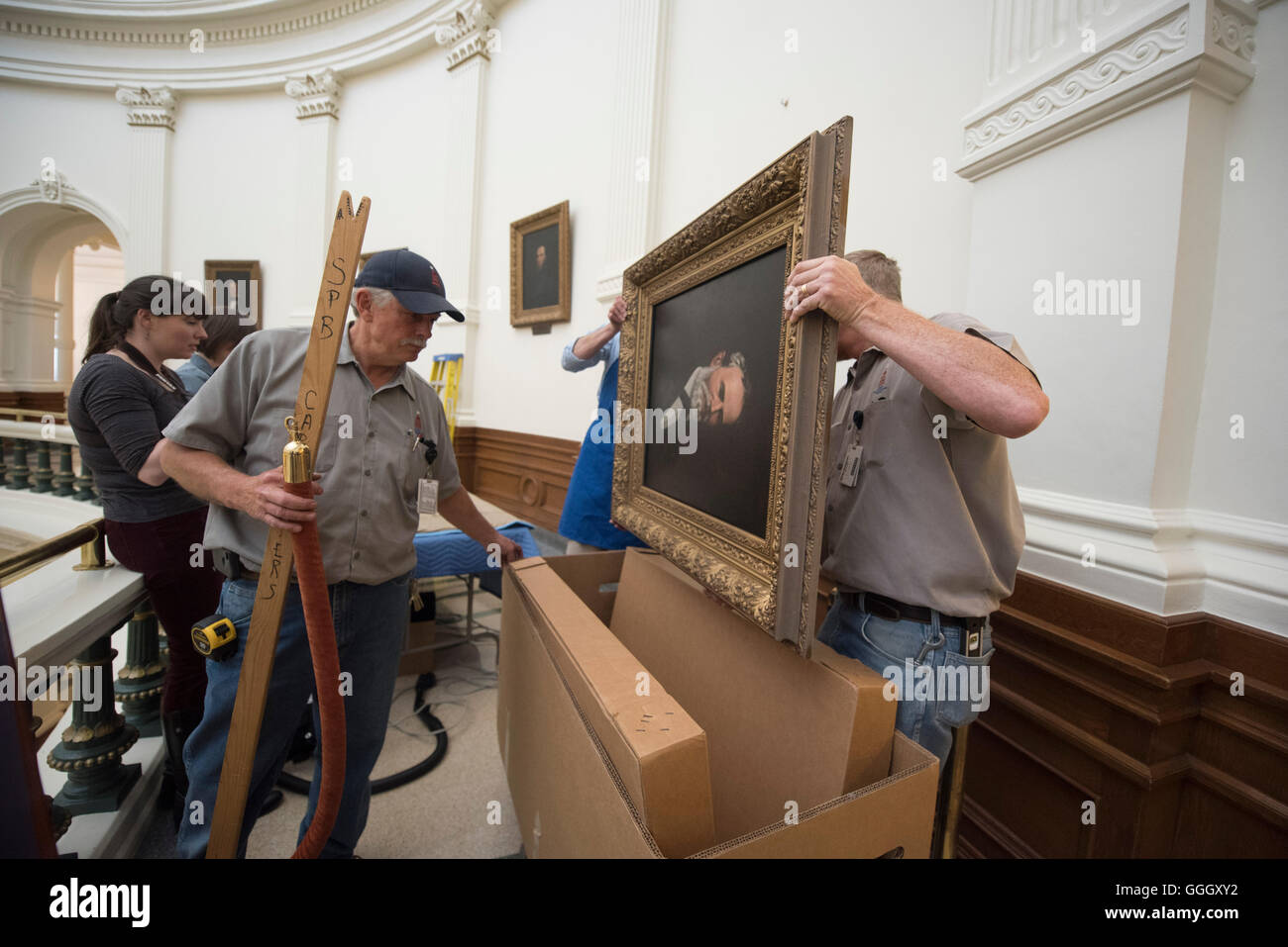 Workers moving all 51 portraits of former Texas governors to make room ...