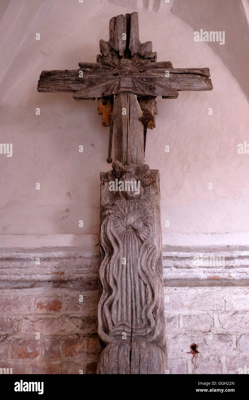 An old wooden crucifix with elaborated depiction of the body of Jesus ...