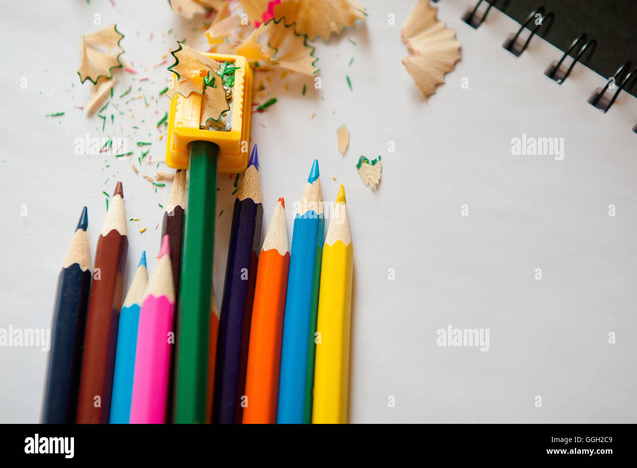 sharpened colored pencils, sharpener and shavings Stock Photo - Alamy