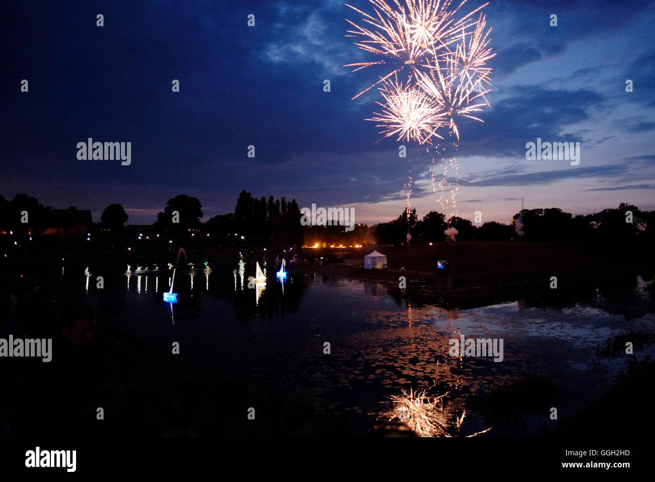 Firework display over light and sound projections on water fountains at ...